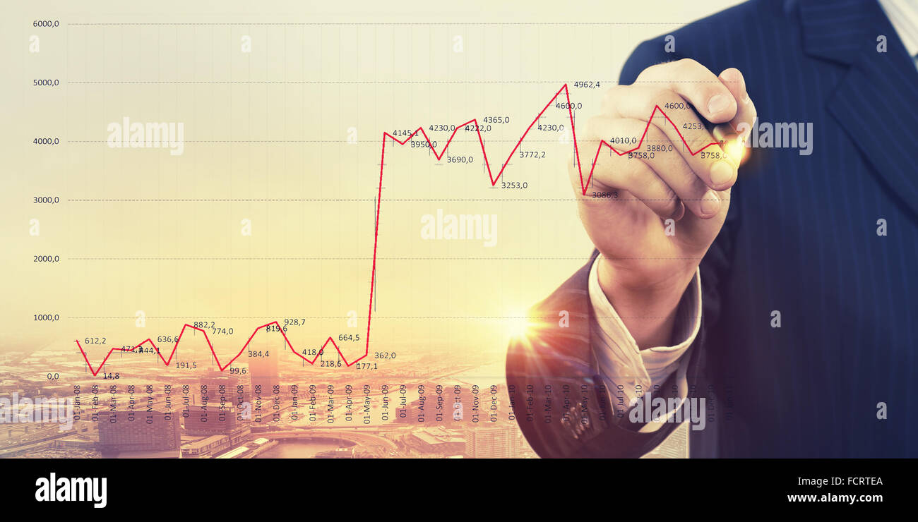 Close up of businessman drawing increasing graph with marker Stock ...