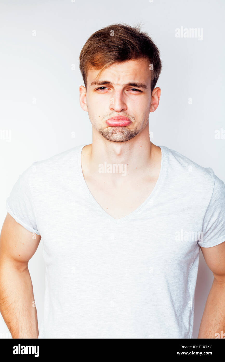 Close Up Portrait Of Loudly Laughing Young Man Isolated On White