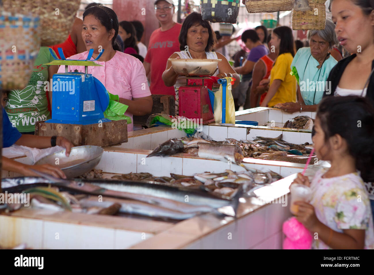 A typical Philippine fish market scene in the Island of Bantayan Island ...