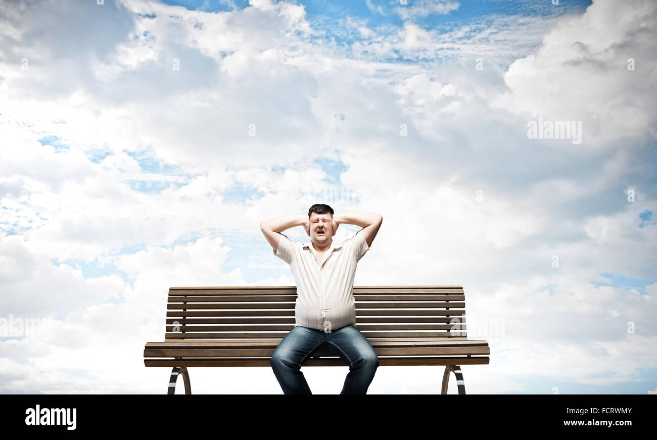 Fat man sitting on bench hi-res stock photography and images - Alamy