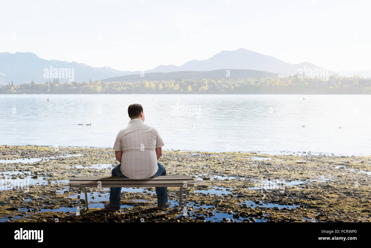 Back fat man sitting on hi-res stock photography and images - Alamy