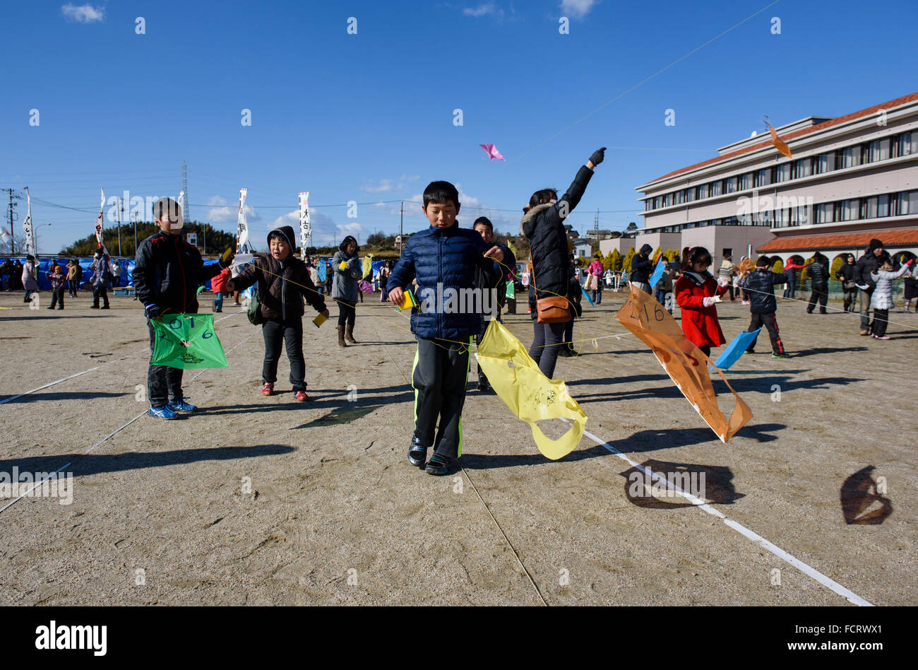 JANUARY 24, 2016 - Children fly kites during a competition in Agui ...