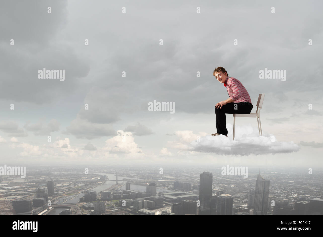Depressed man sitting on a chair all alone Stock Photo - Alamy