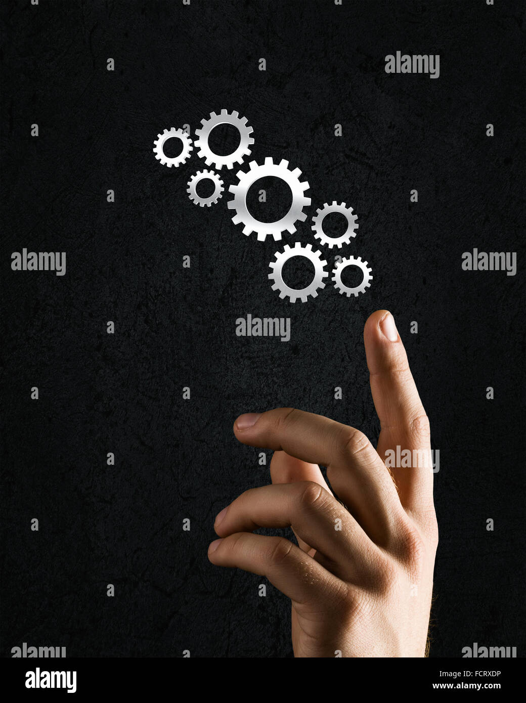 Close up human hand pointing at gears mechanism Stock Photo - Alamy