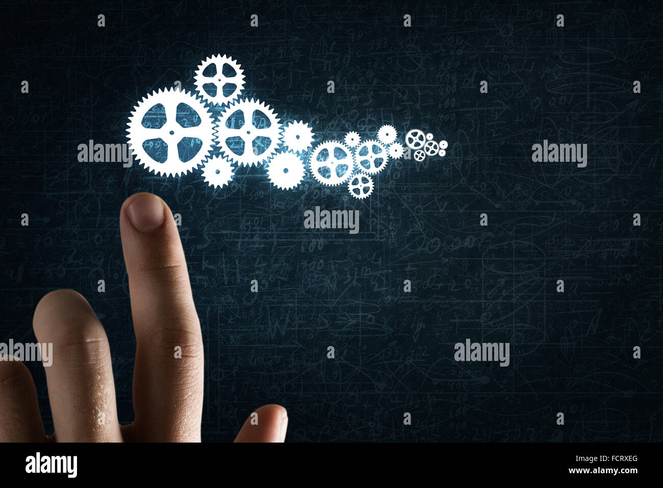 Close up human hand pointing at gears mechanism Stock Photo - Alamy