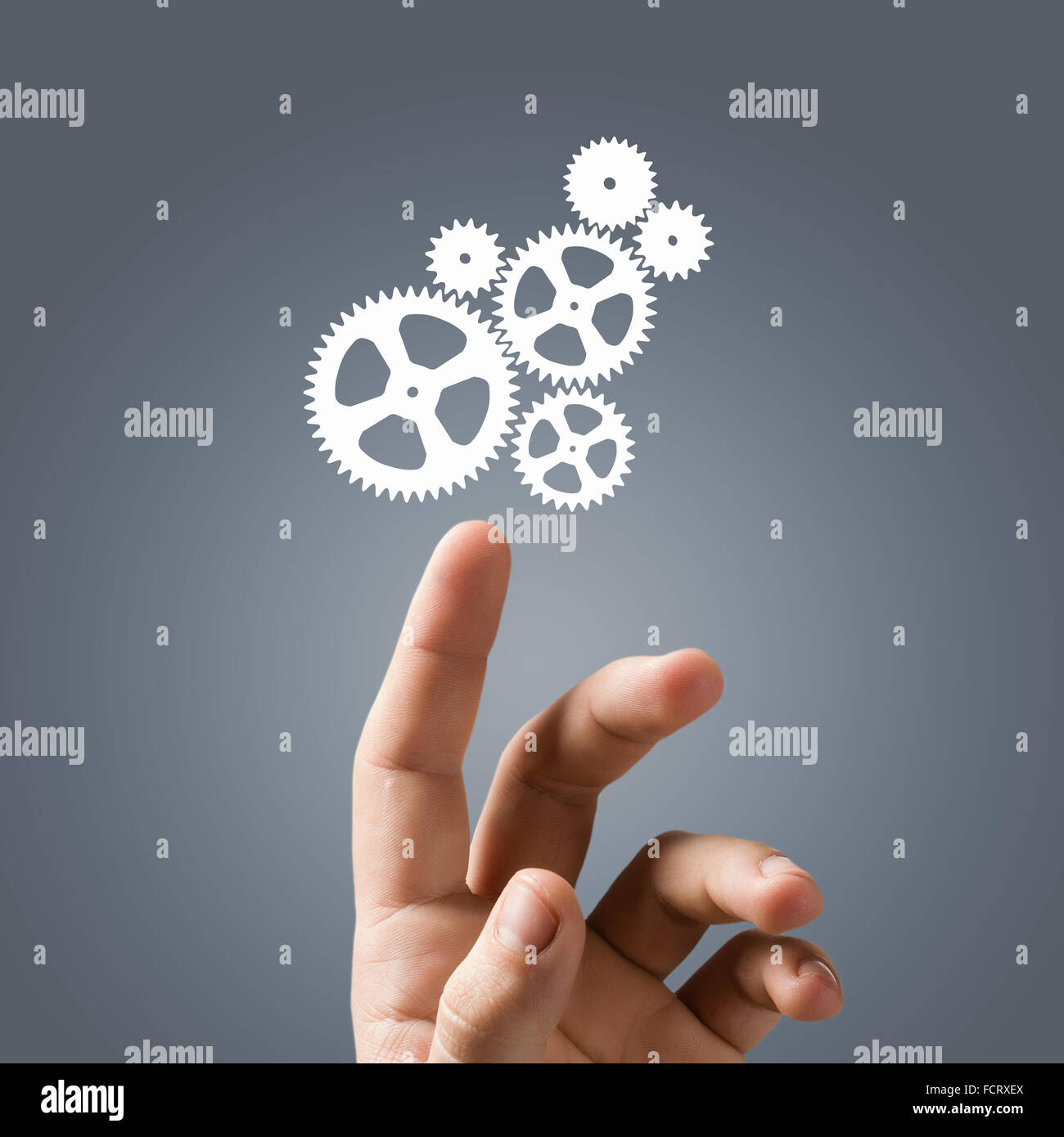 Close up human hand pointing at gears mechanism Stock Photo - Alamy