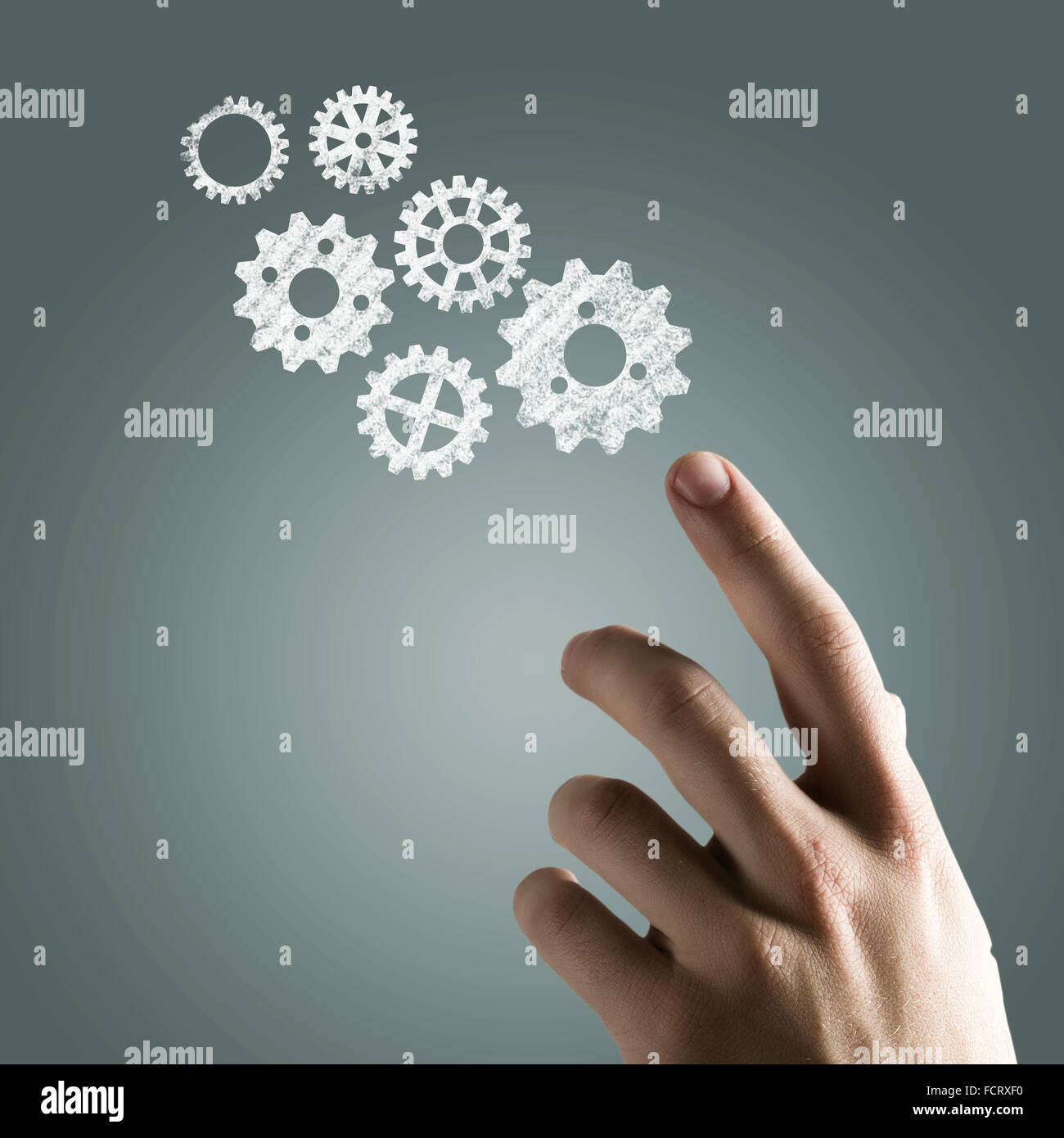 Close up human hand pointing at gears mechanism Stock Photo - Alamy