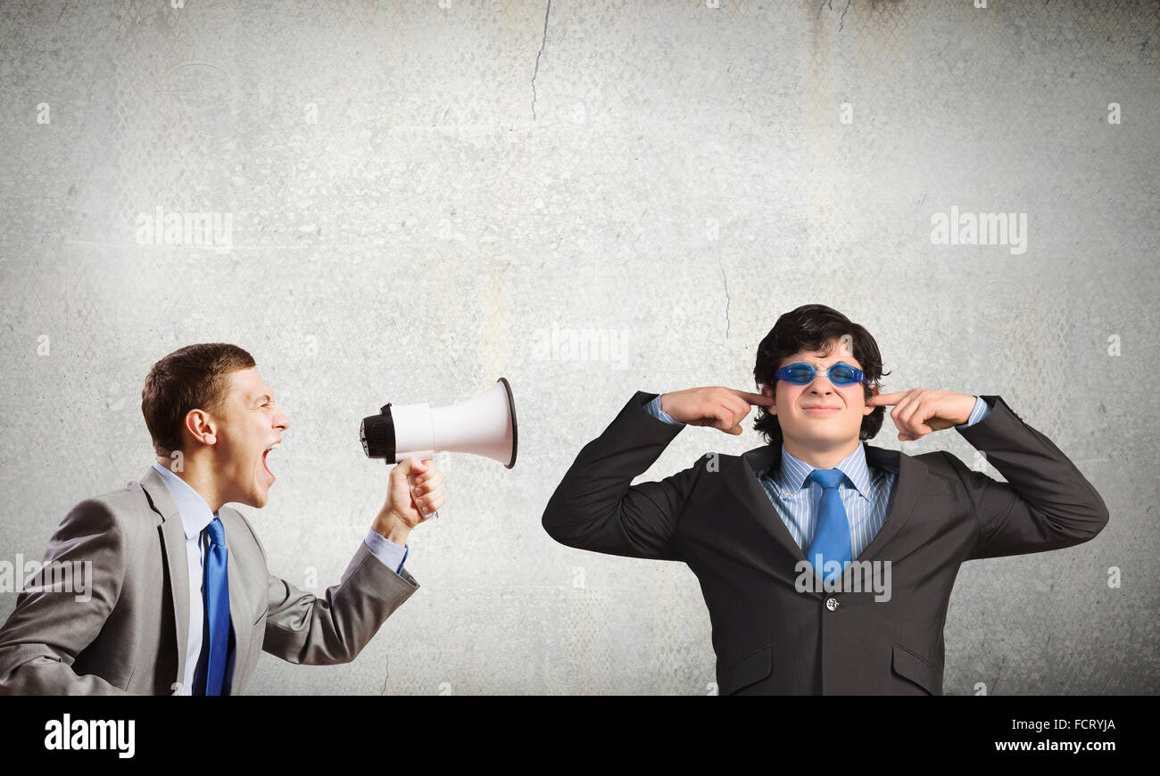 Young furious woman screaming agressively in megaphone Stock Photo - Alamy