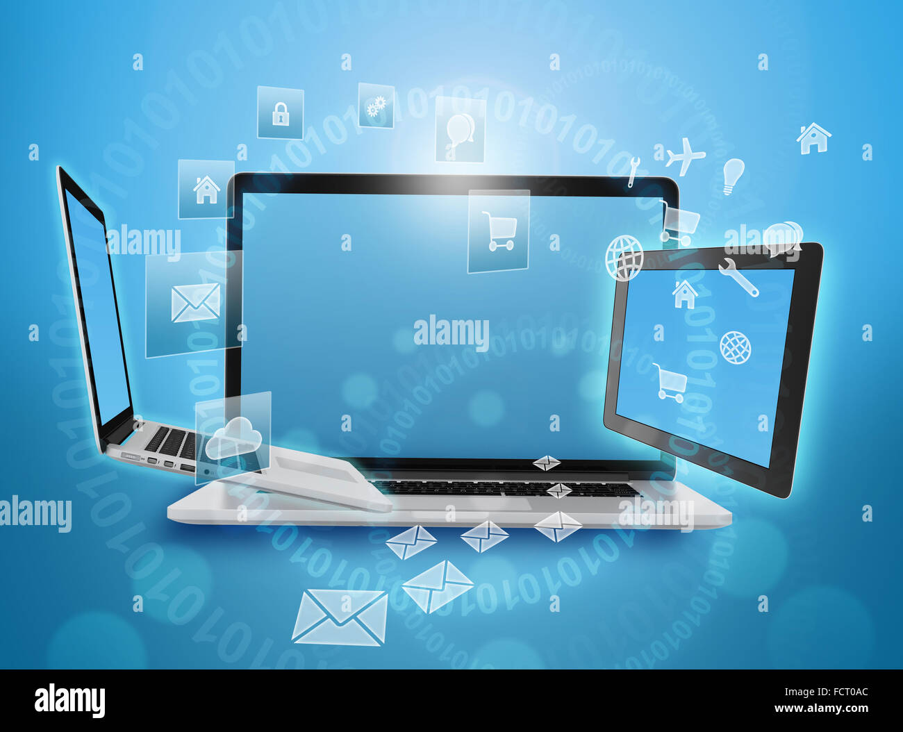 computers and tablet with rotating icons around Stock Photo - Alamy