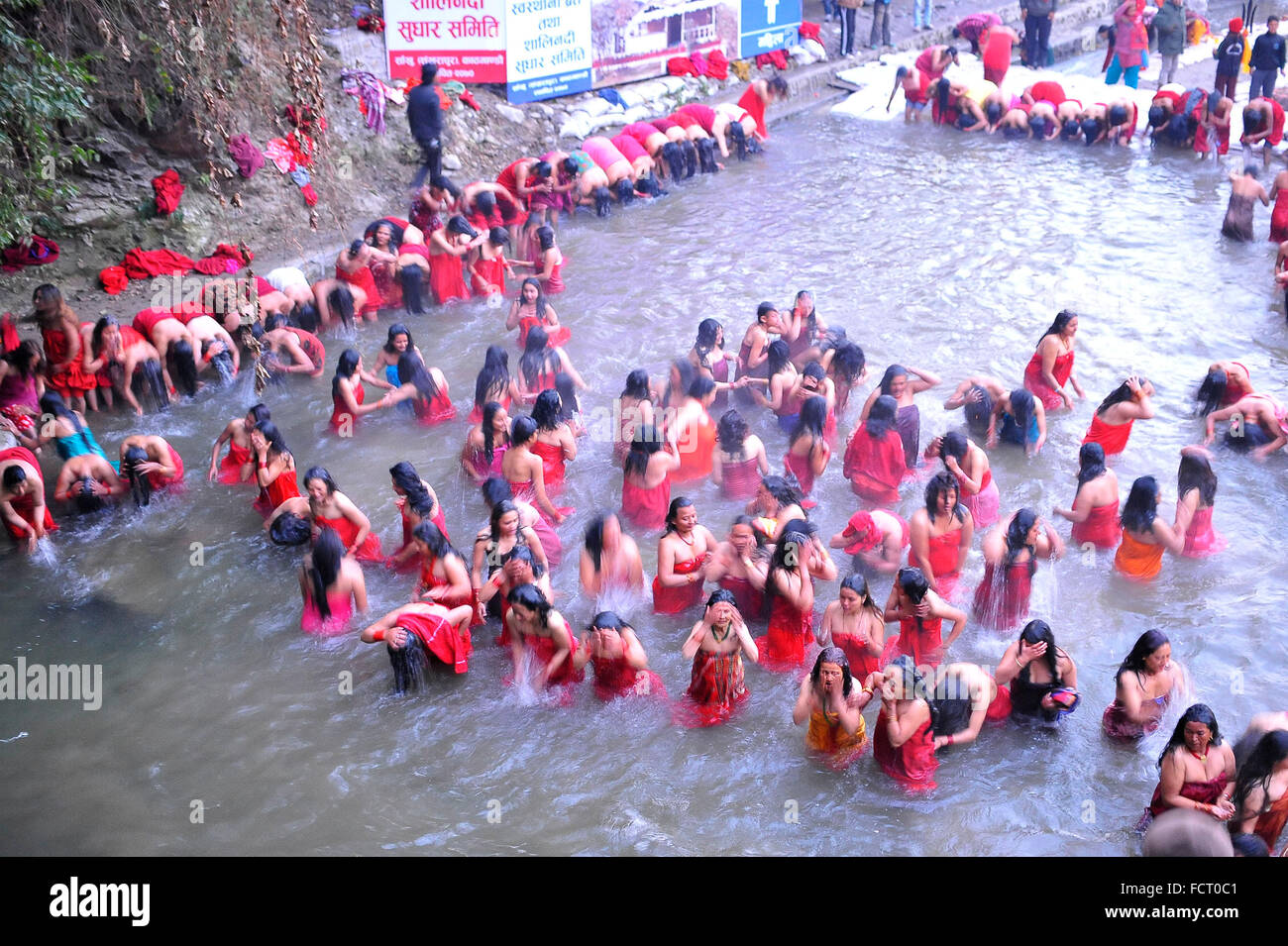 Woman takes holy bath in hi-res stock photography and images - Alamy