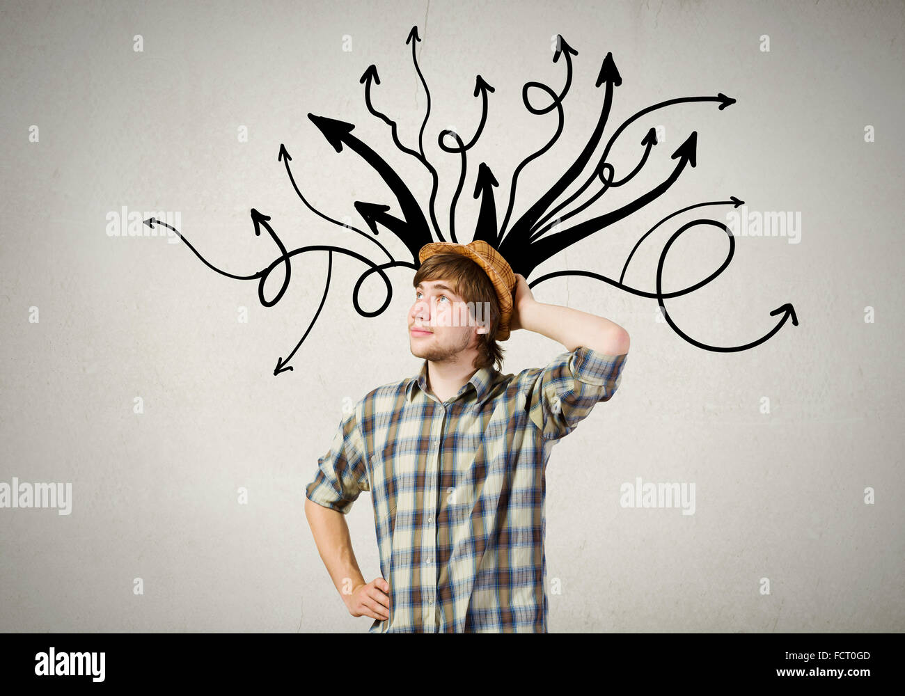 Young thoughtful guy and arrows coming out of his head Stock Photo - Alamy