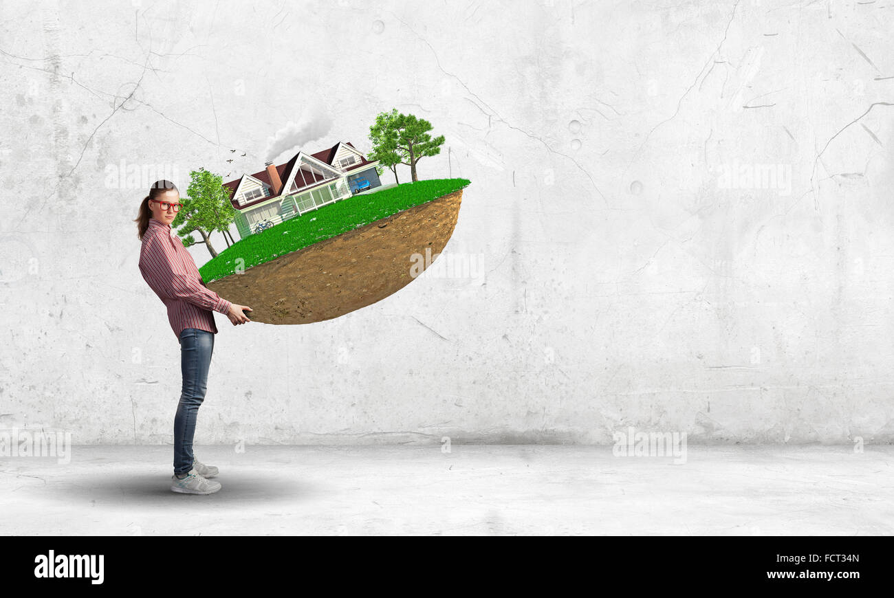 Young girl student carrying model of green concept Stock Photo - Alamy