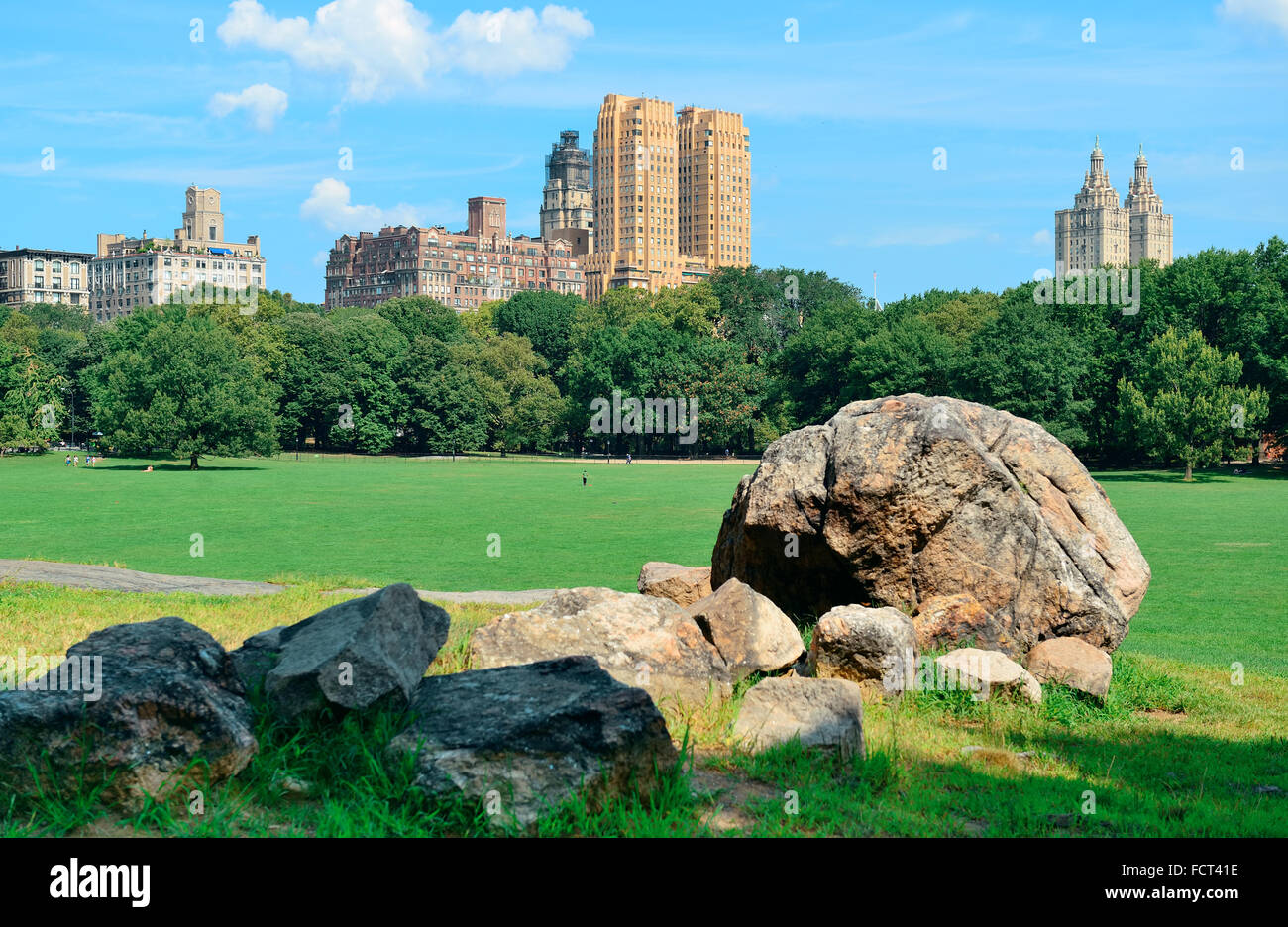 Central Park Spring with skyline in midtown Manhattan New York City ...