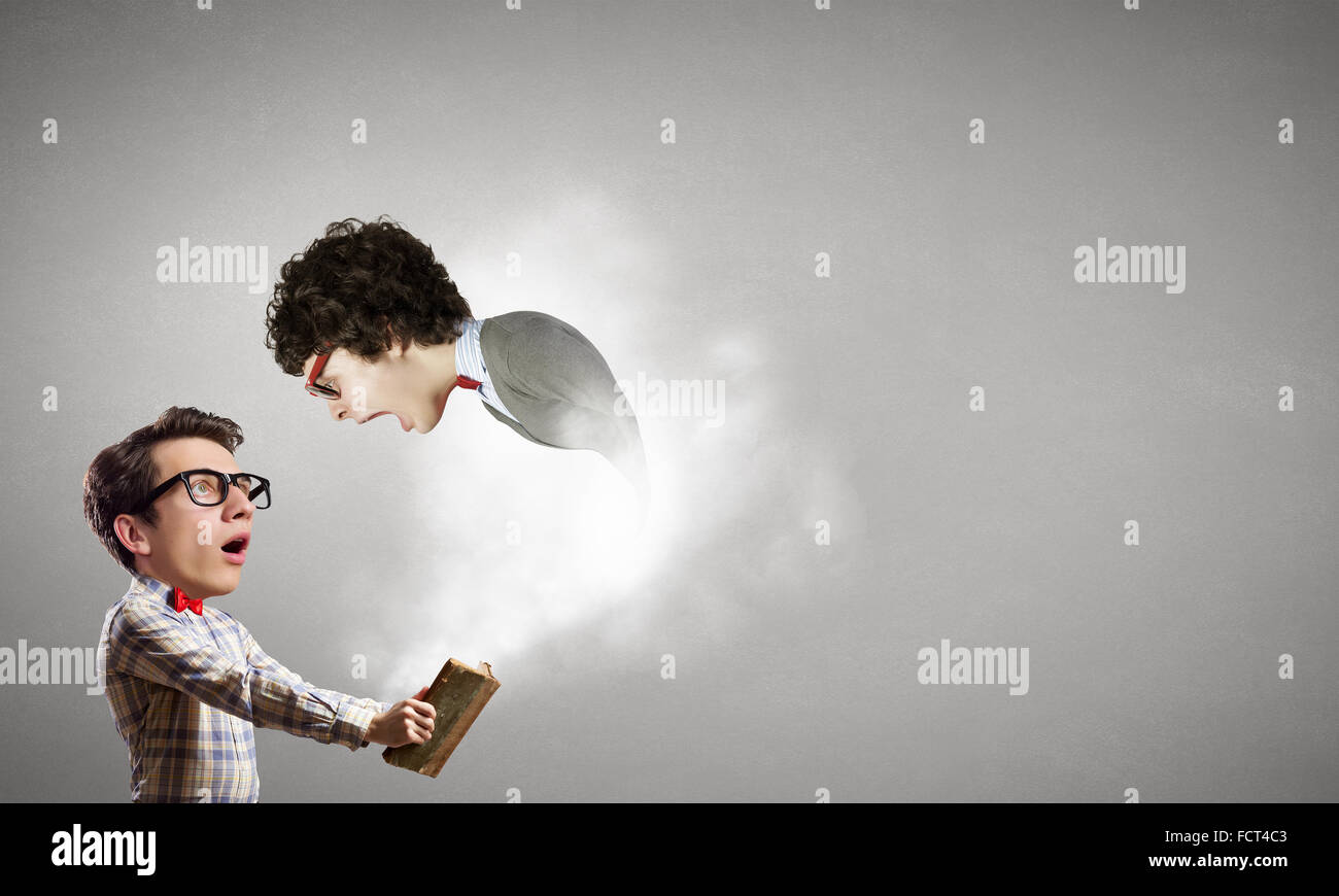 Funny big headed man in glasses with book in hands Stock Photo - Alamy