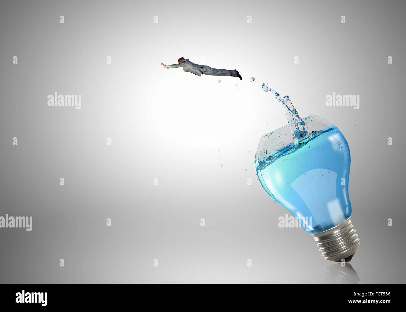 Conceptual image with light bulb filled with clear water and ...