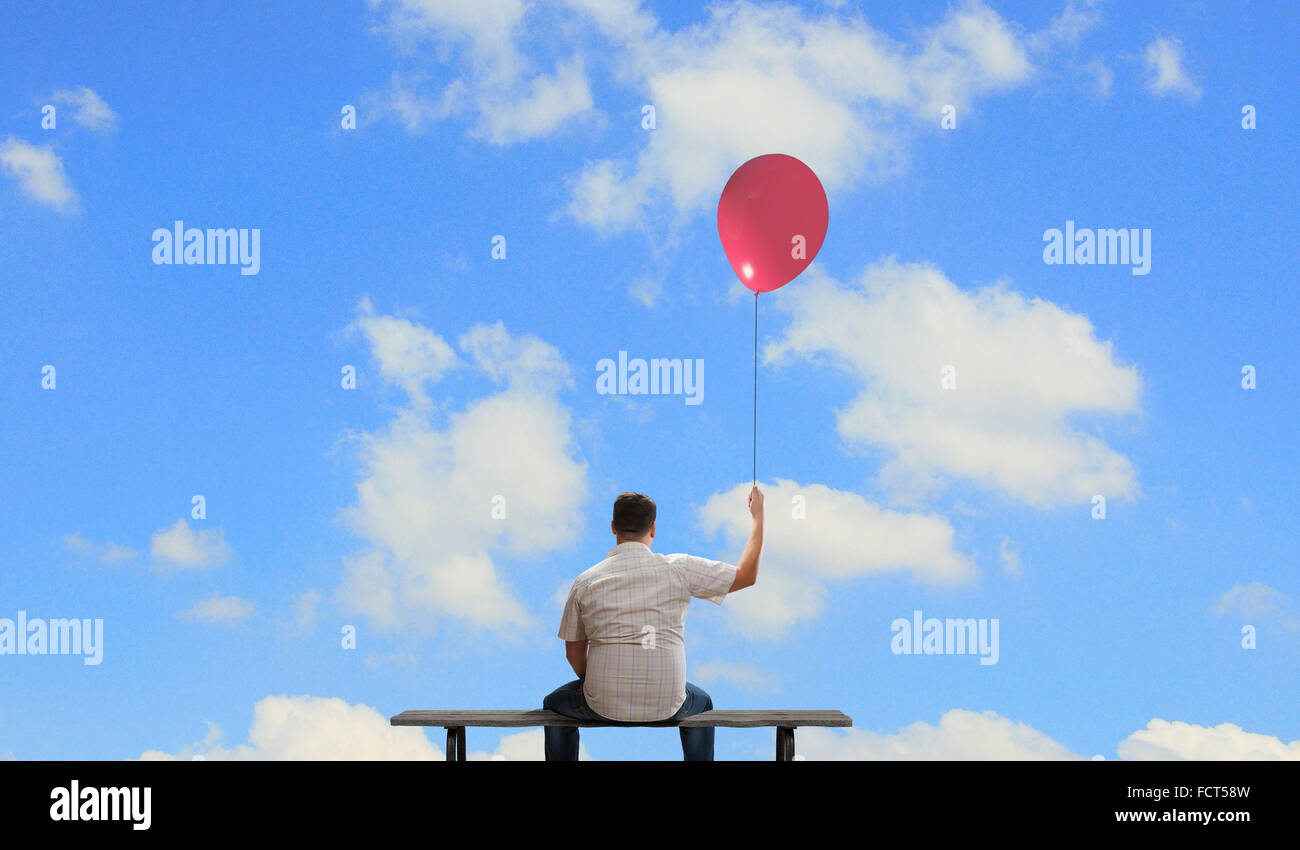 Fat man sitting on bench with his back with balloon in hand Stock Photo ...