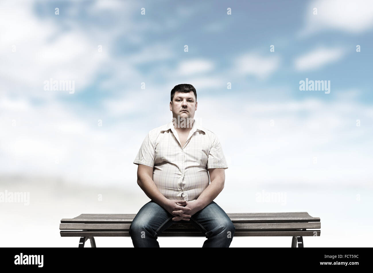 Fat man sitting on bench and looking in camera Stock Photo - Alamy