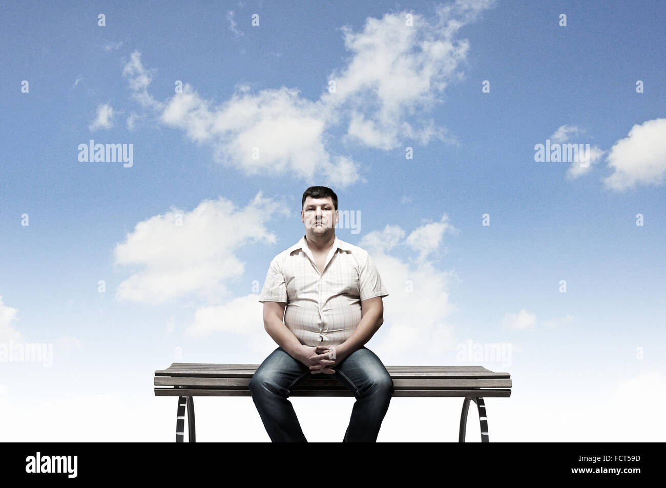 Fat man sitting on bench and looking in camera Stock Photo - Alamy