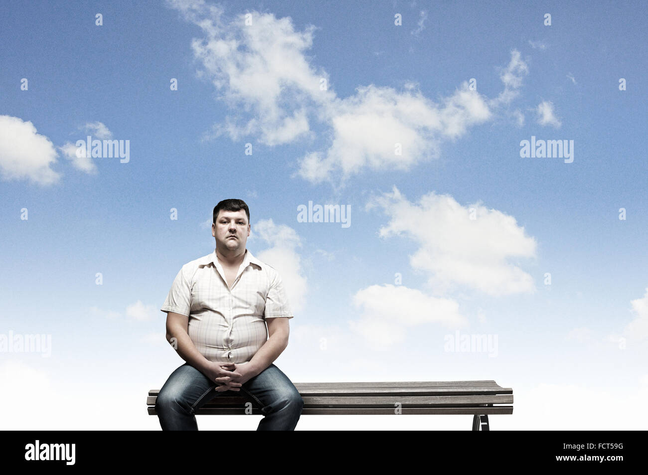 Fat man sitting on bench and looking in camera Stock Photo - Alamy