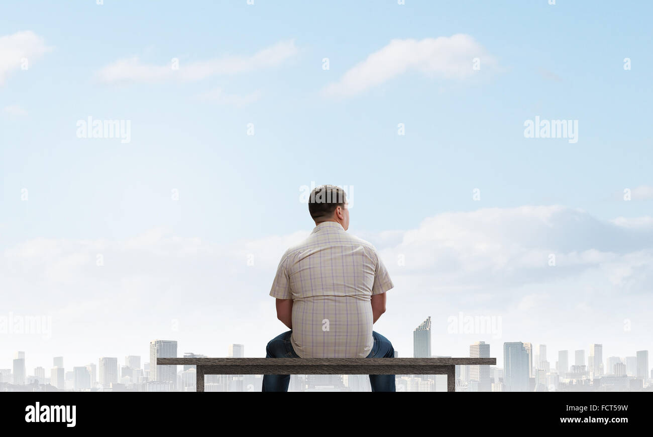 Fat Man Sitting On Bench Stock Photos & Fat Man Sitting On Bench Stock ...
