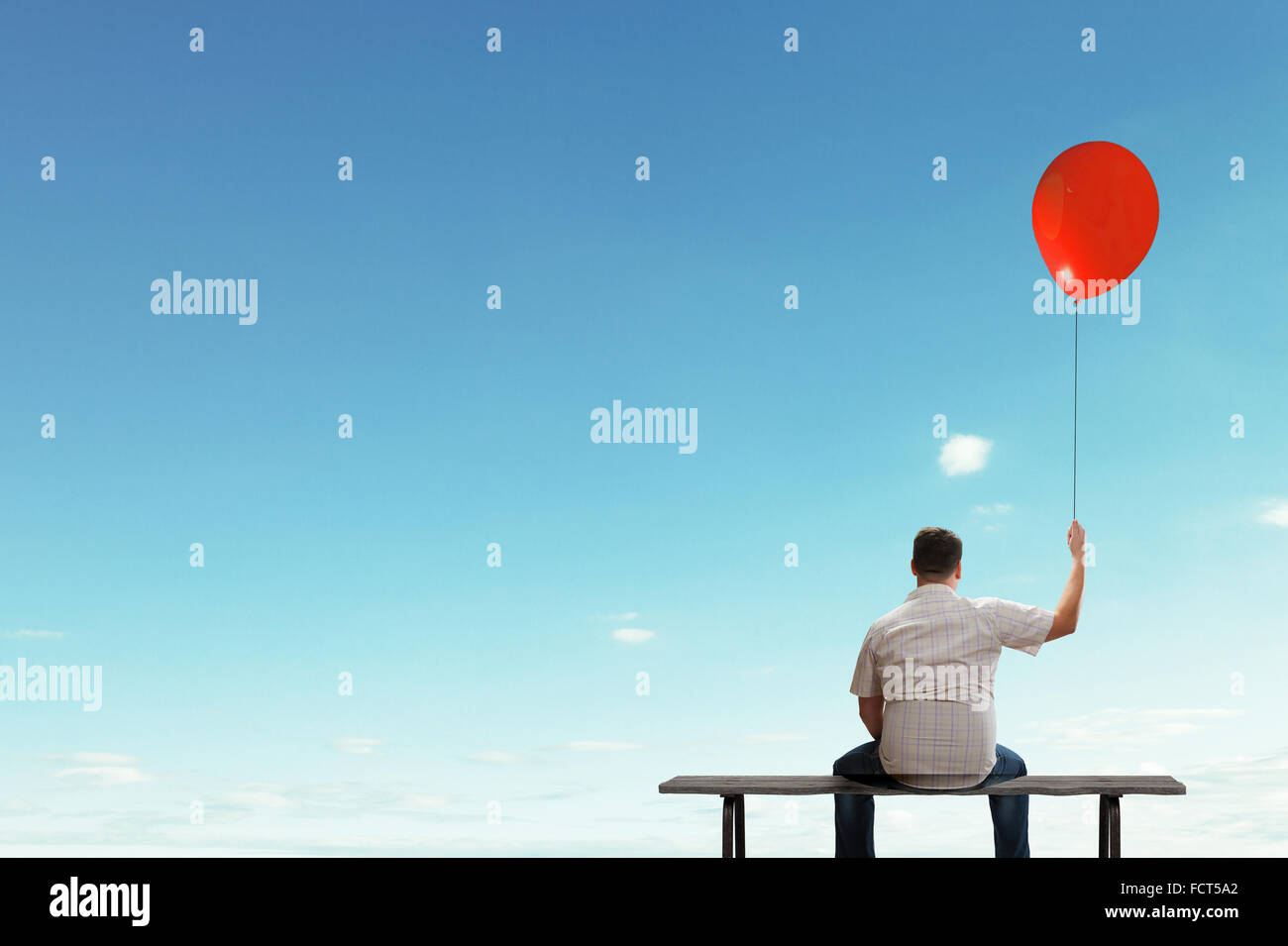 Fat man sitting on bench with his back with balloon in hand Stock Photo ...