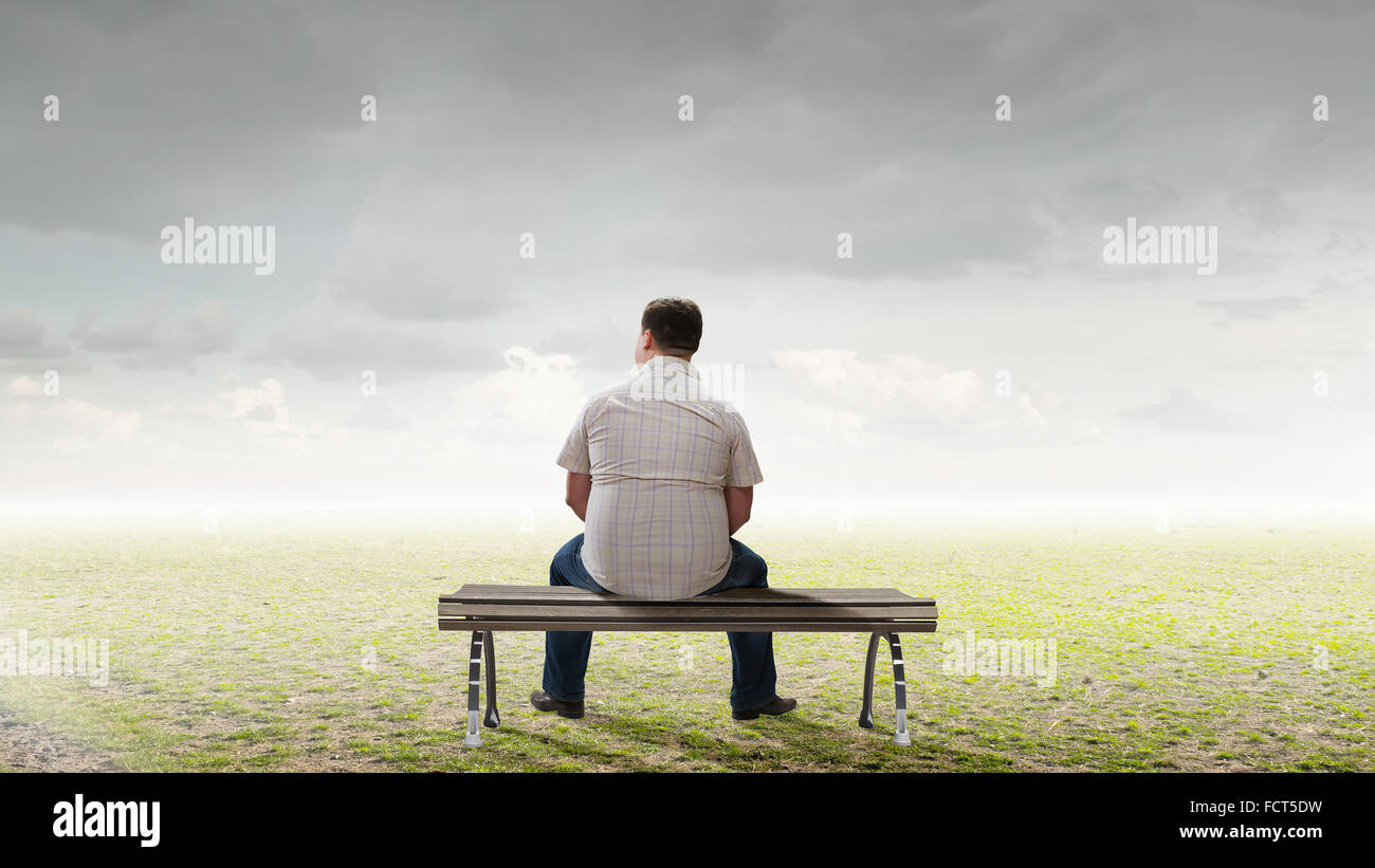Fat Man Sitting On Bench Stock Photos & Fat Man Sitting On Bench Stock ...