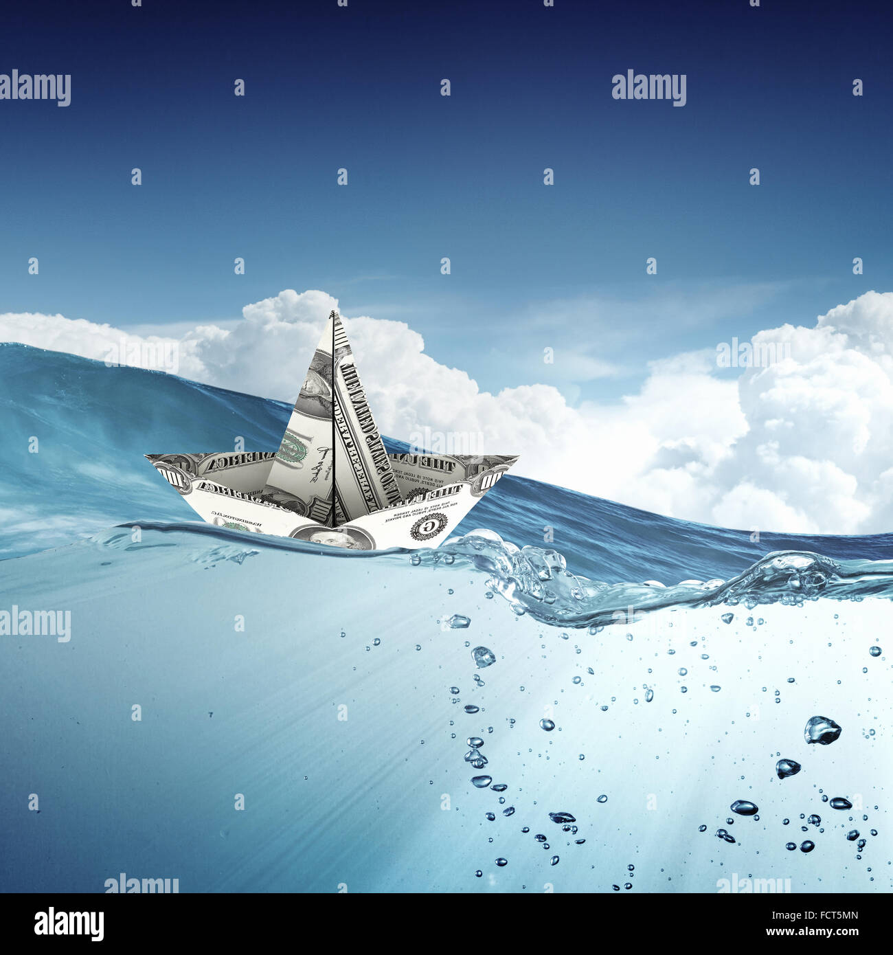 Ship made of dollar banknote floating in water Stock Photo - Alamy