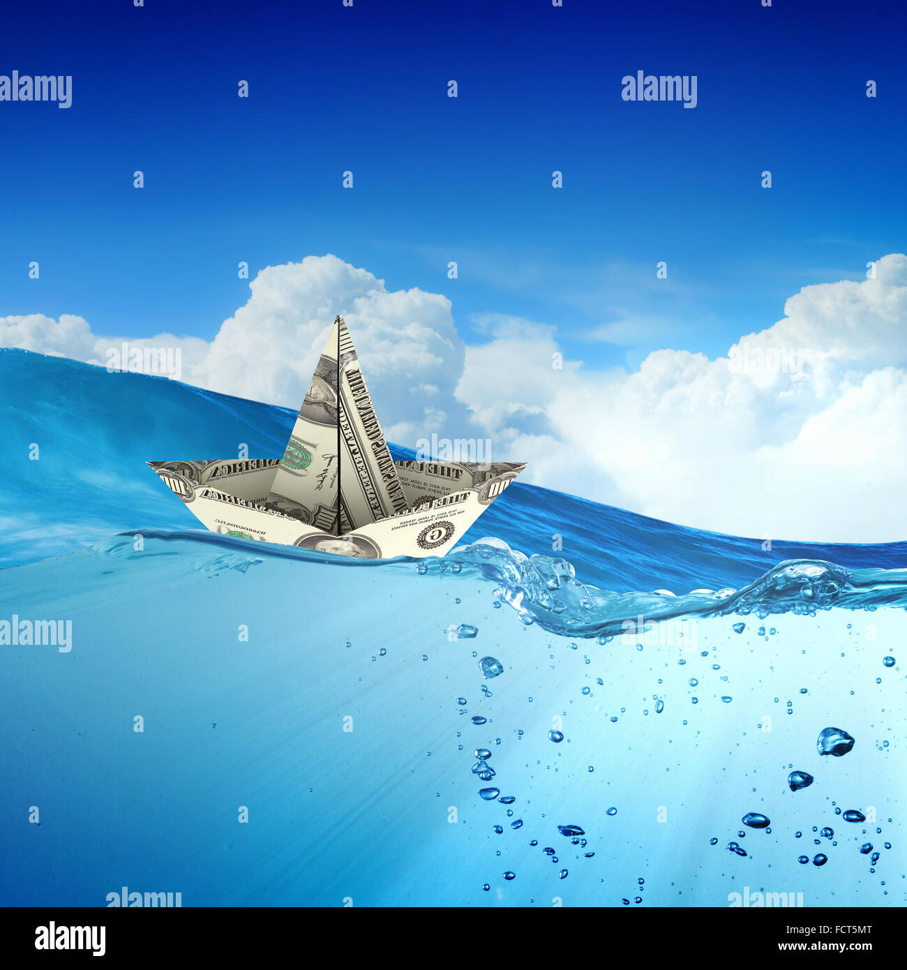 Ship made of dollar banknote floating in water Stock Photo - Alamy