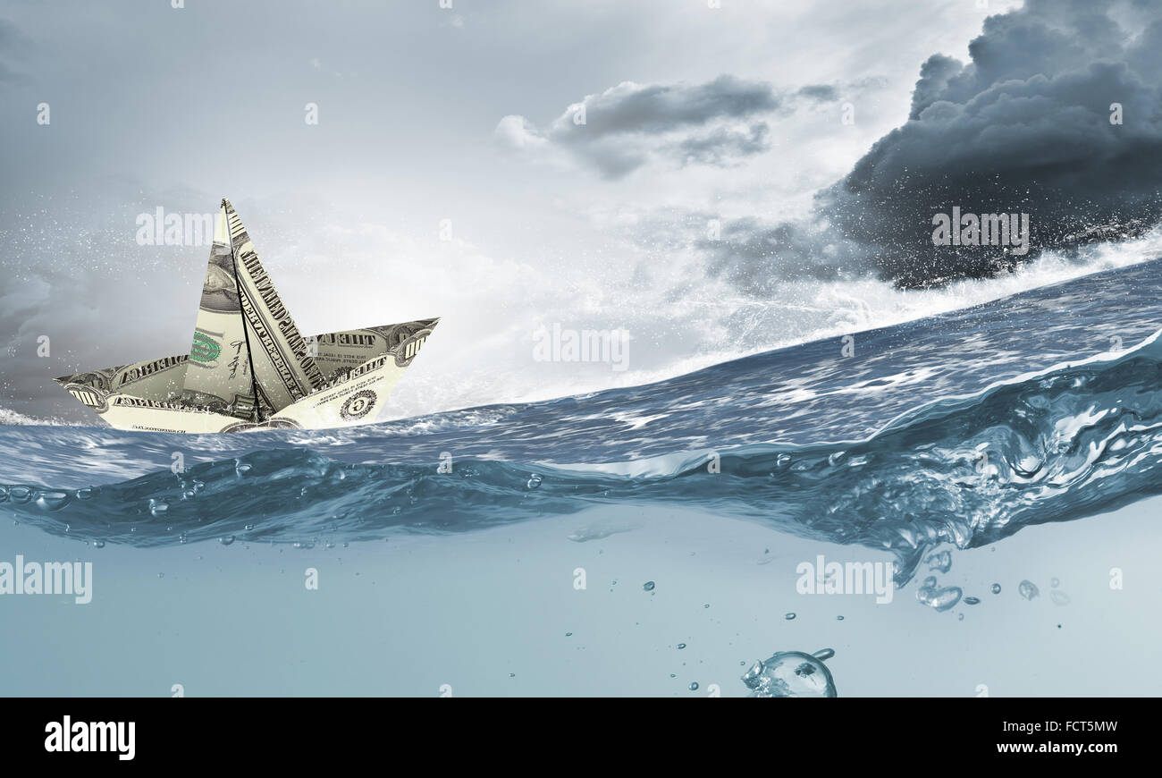 Ship made of dollar banknote floating in water Stock Photo - Alamy