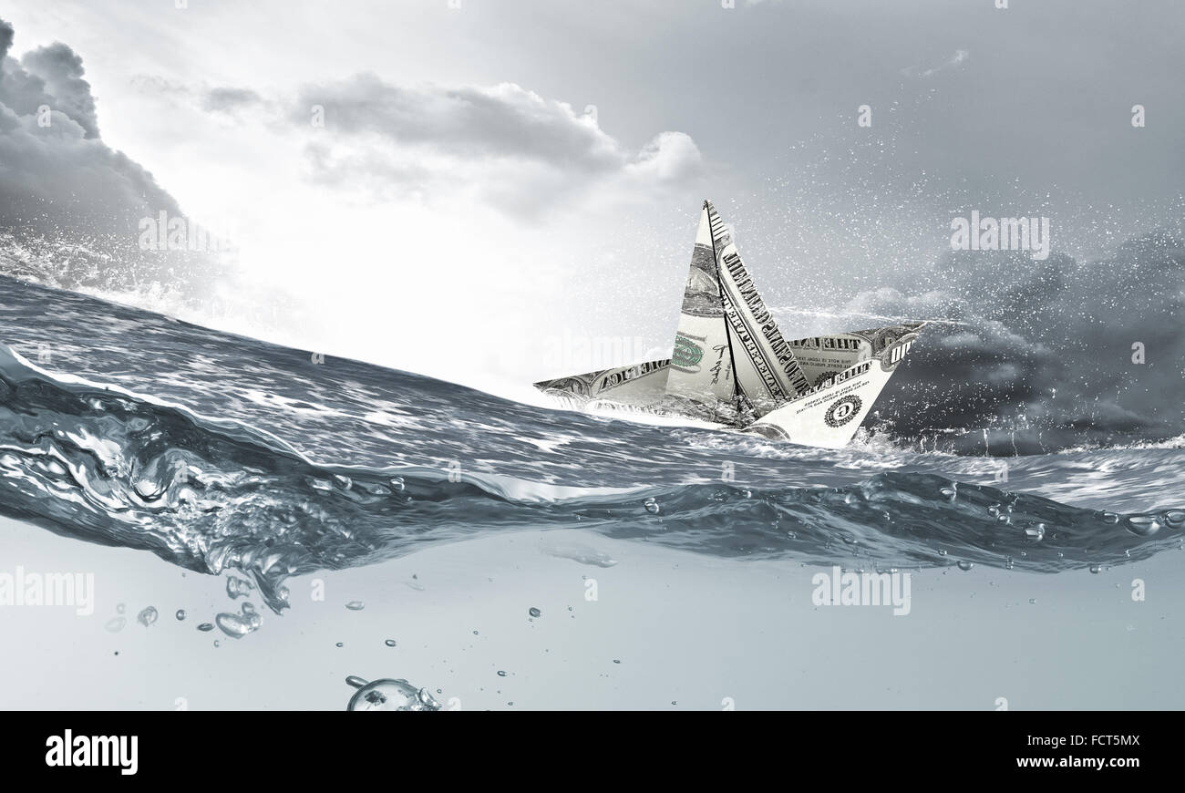 Ship made of dollar banknote floating in water Stock Photo - Alamy