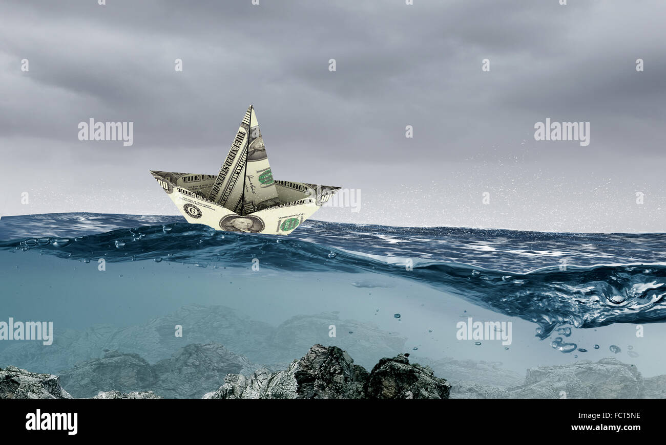 Ship made of dollar banknote floating in water Stock Photo - Alamy