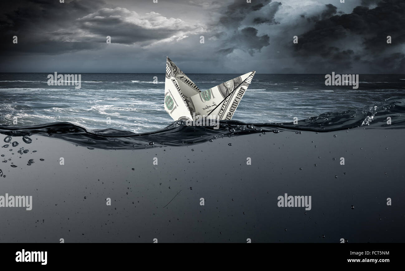 Ship made of dollar banknote sinking in water Stock Photo - Alamy