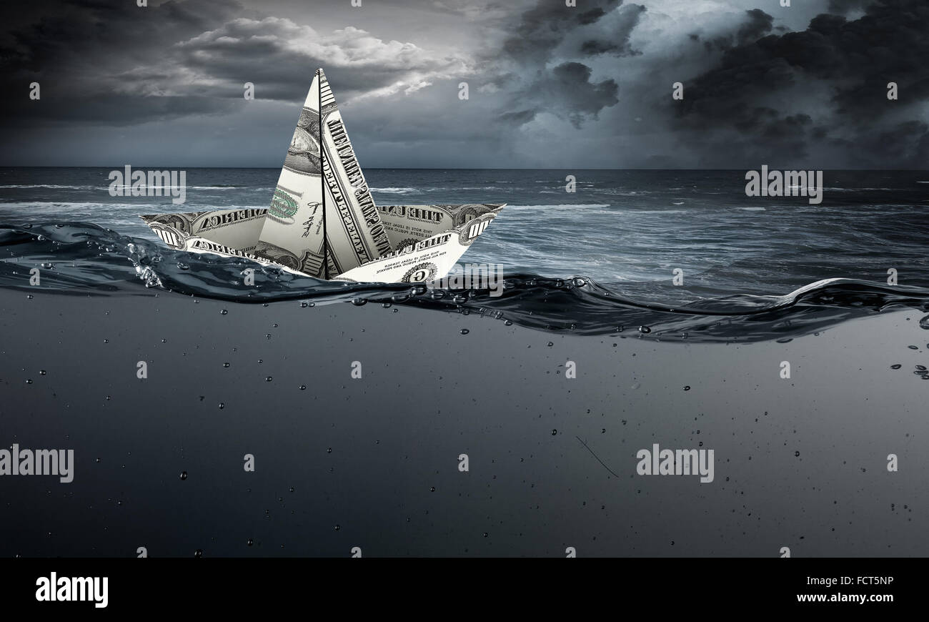 Ship made of dollar banknote floating in water Stock Photo - Alamy