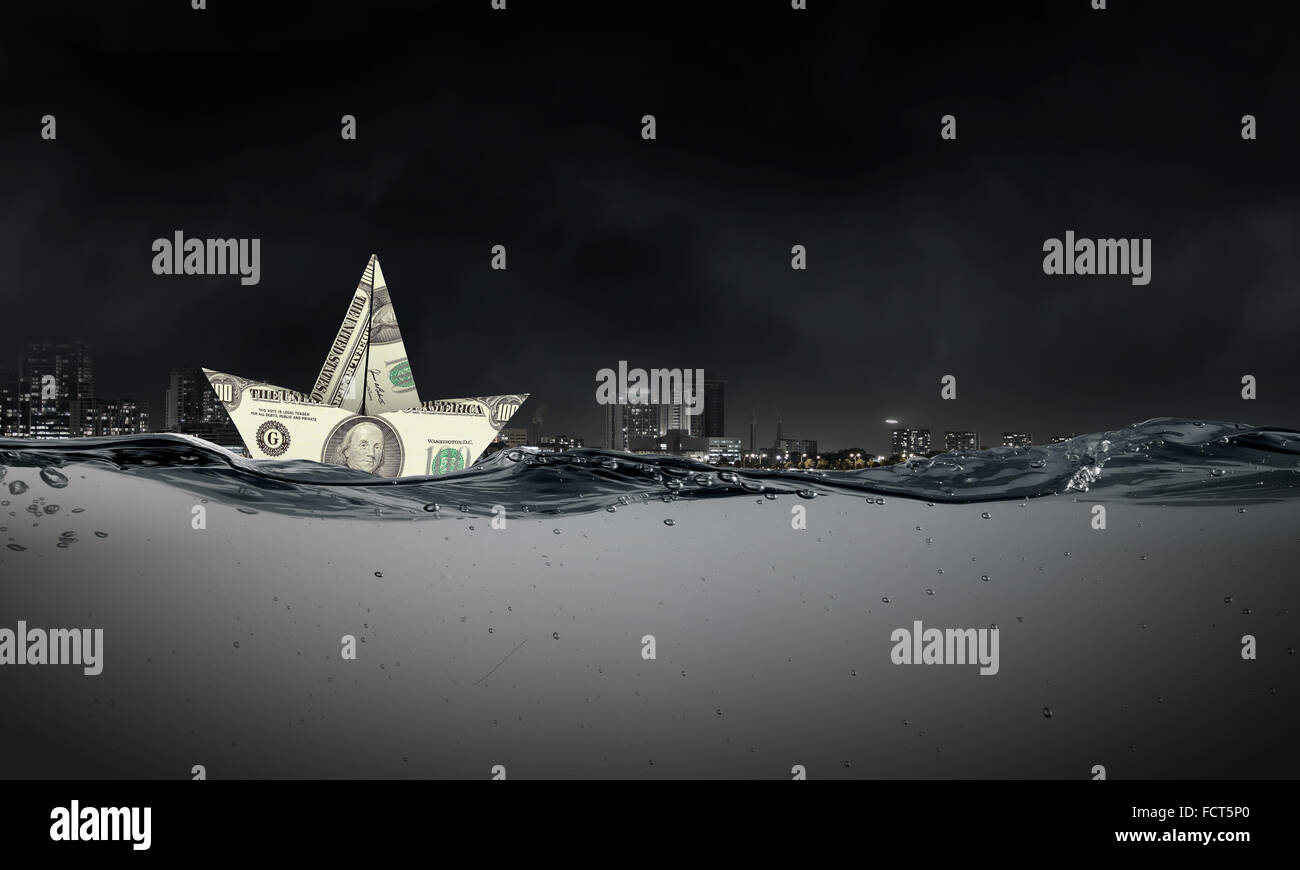 Ship made of dollar banknote floating in water Stock Photo - Alamy