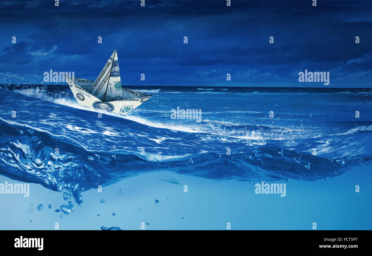 Ship made of dollar banknote floating in water Stock Photo - Alamy