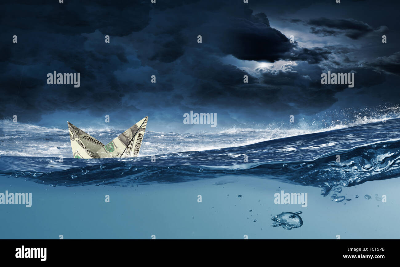 Ship made of dollar banknote sinking in water Stock Photo - Alamy