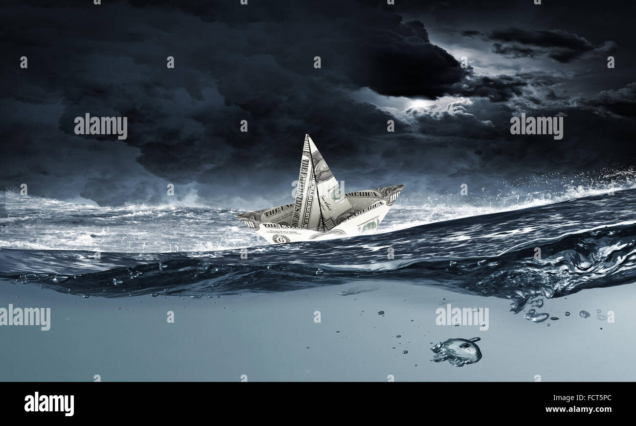 Ship made of dollar banknote floating in water Stock Photo - Alamy