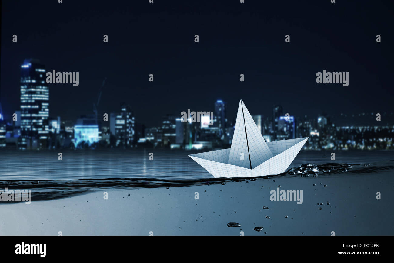 Boat made of paper sailing on blue water surface Stock Photo - Alamy