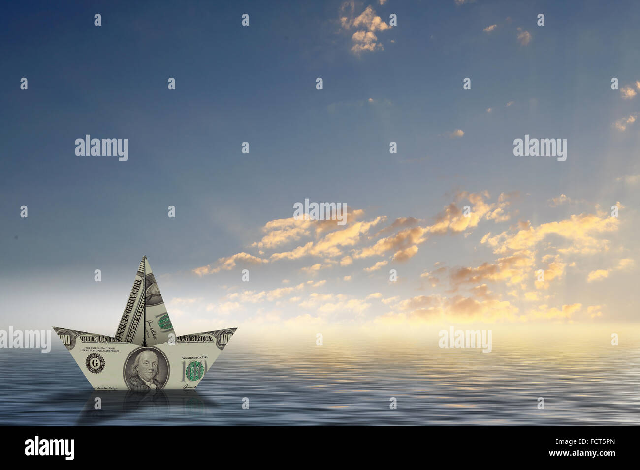 Ship made of dollar banknote floating in water Stock Photo - Alamy