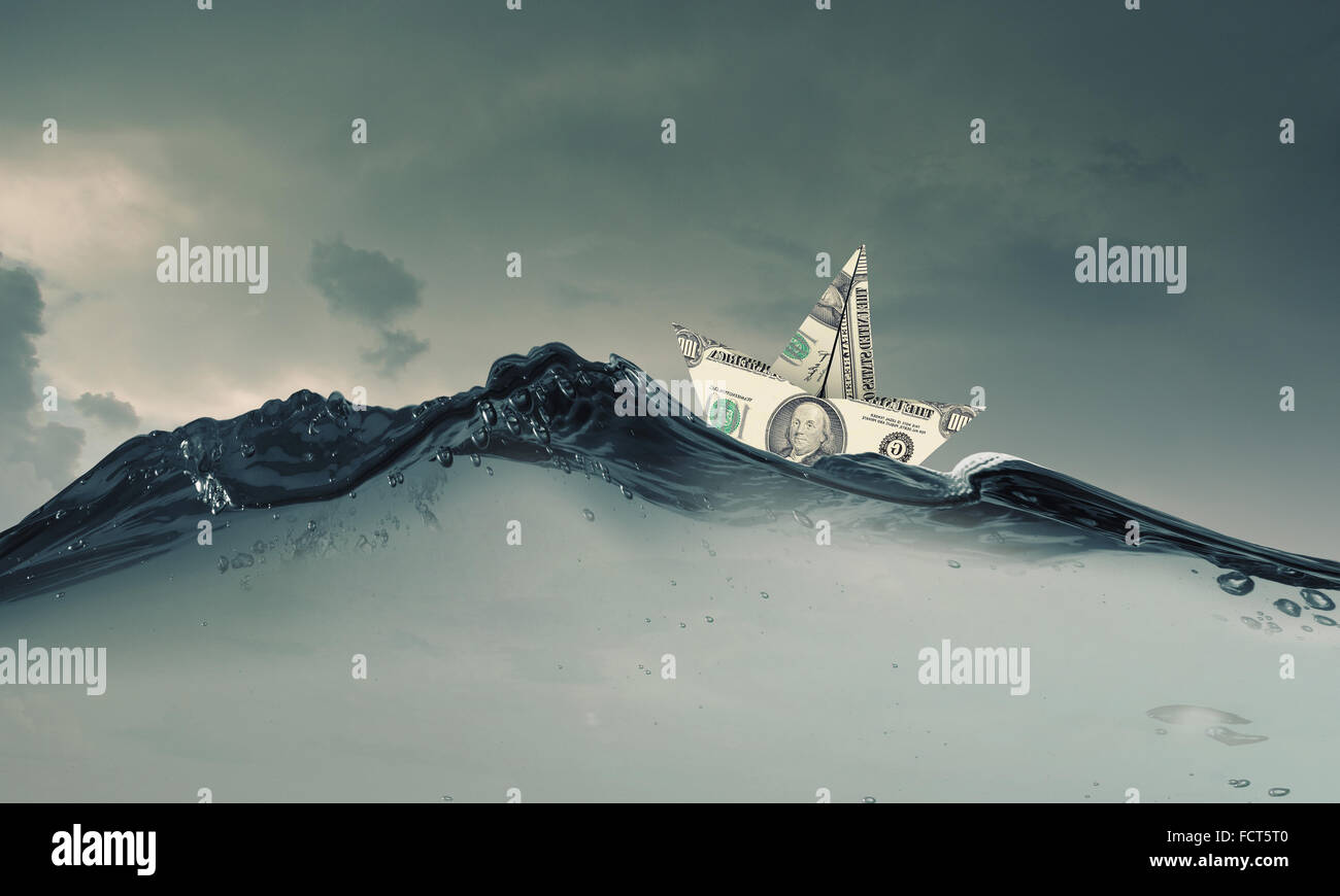 Ship made of dollar banknote floating in water Stock Photo - Alamy