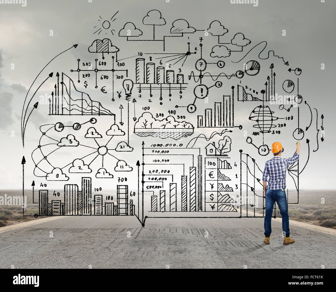 Back view of man engineer drawing plan sketches on wall Stock Photo - Alamy