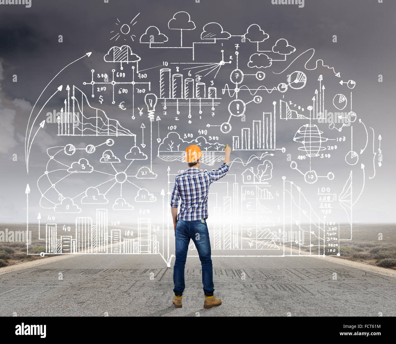 Back view of man engineer drawing plan sketches on wall Stock Photo - Alamy