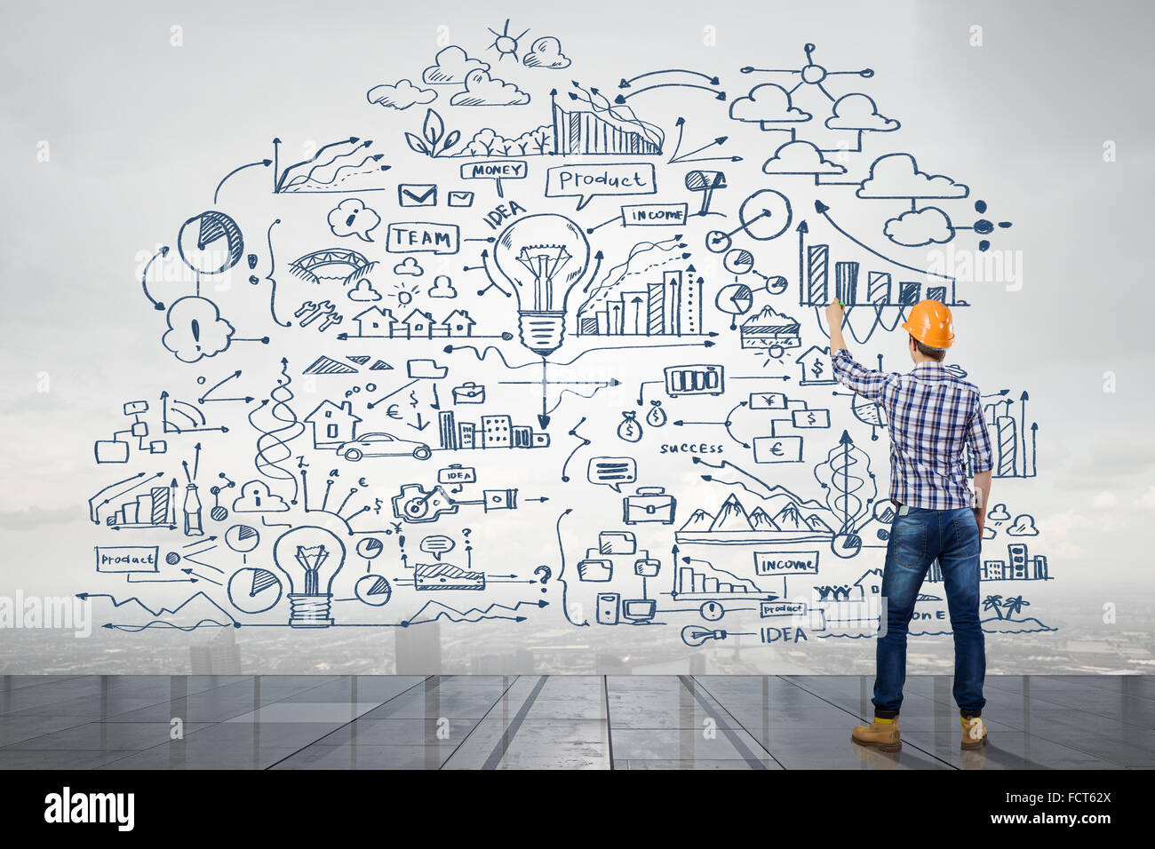 Back view of man engineer drawing plan sketches on wall Stock Photo - Alamy