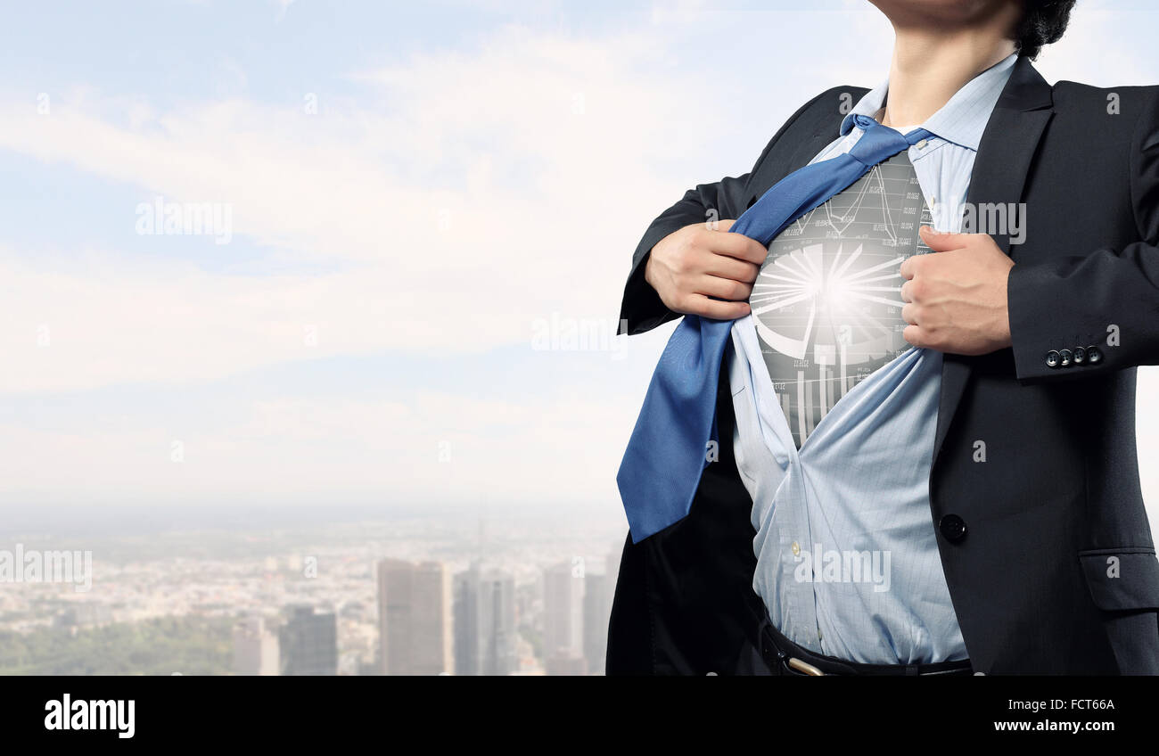 Businessman opening his shirt on chest acting like super hero Stock ...