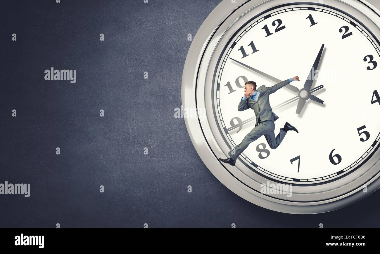 Concept of time with funny businessman running in a hurry Stock Photo ...