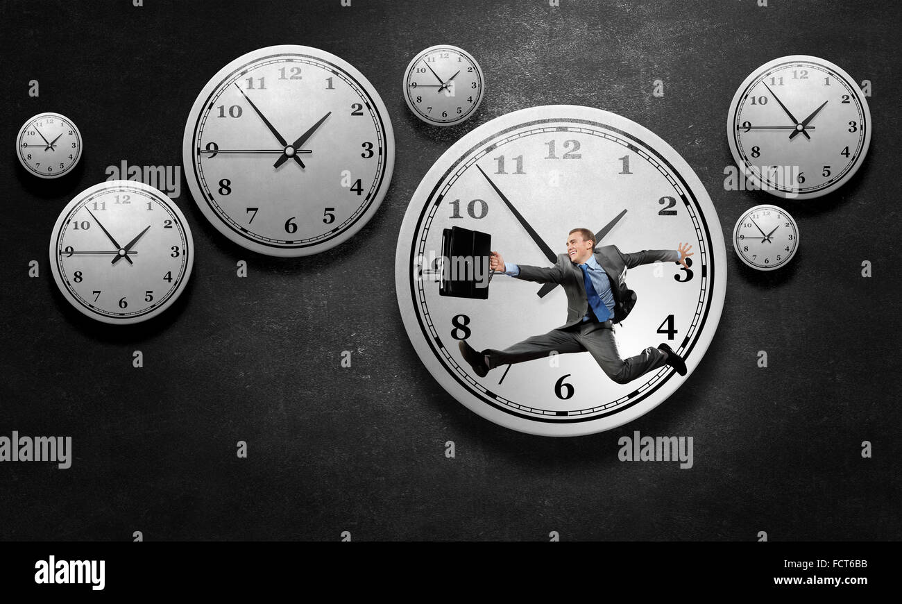 Concept of time with funny businessman running in a hurry Stock Photo ...