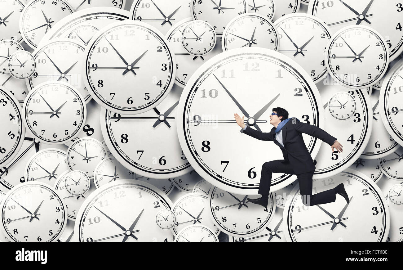 Concept of time with funny businessman running in a hurry Stock Photo ...