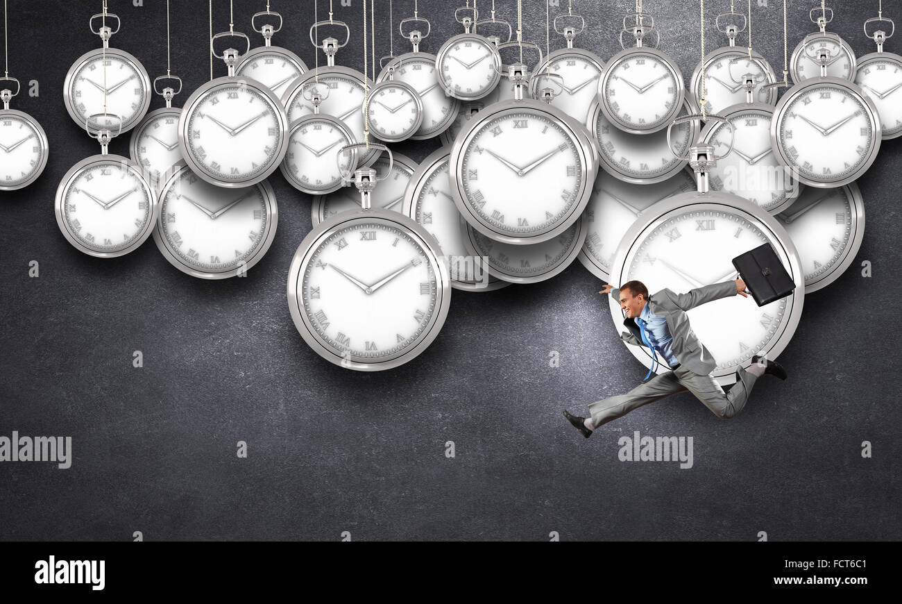 Concept of time with funny businessman running in a hurry Stock Photo ...