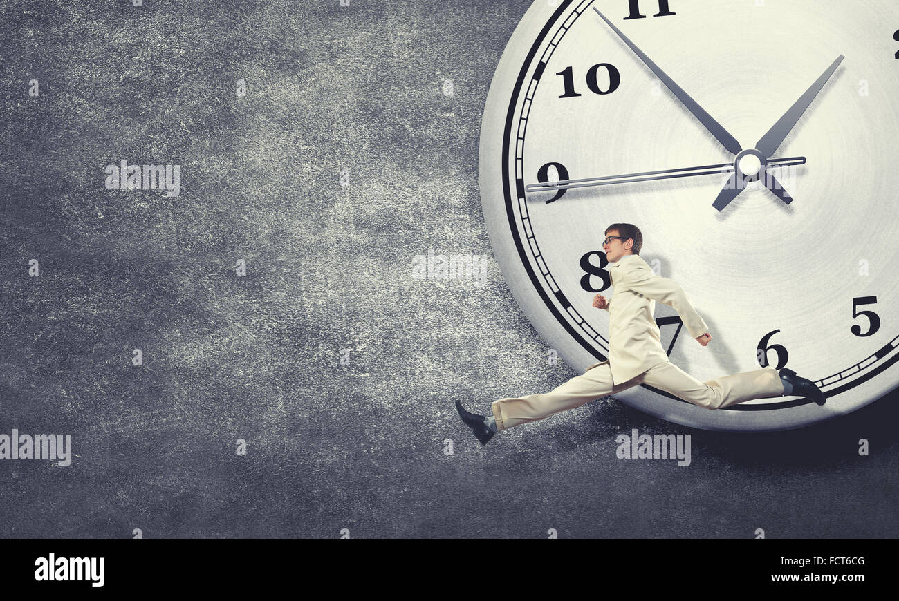 Concept of time with funny businessman running in a hurry Stock Photo ...