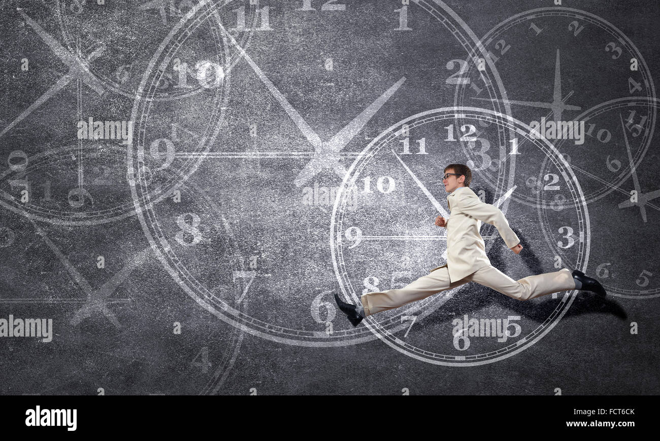 Concept of time with funny businessman running in a hurry Stock Photo ...